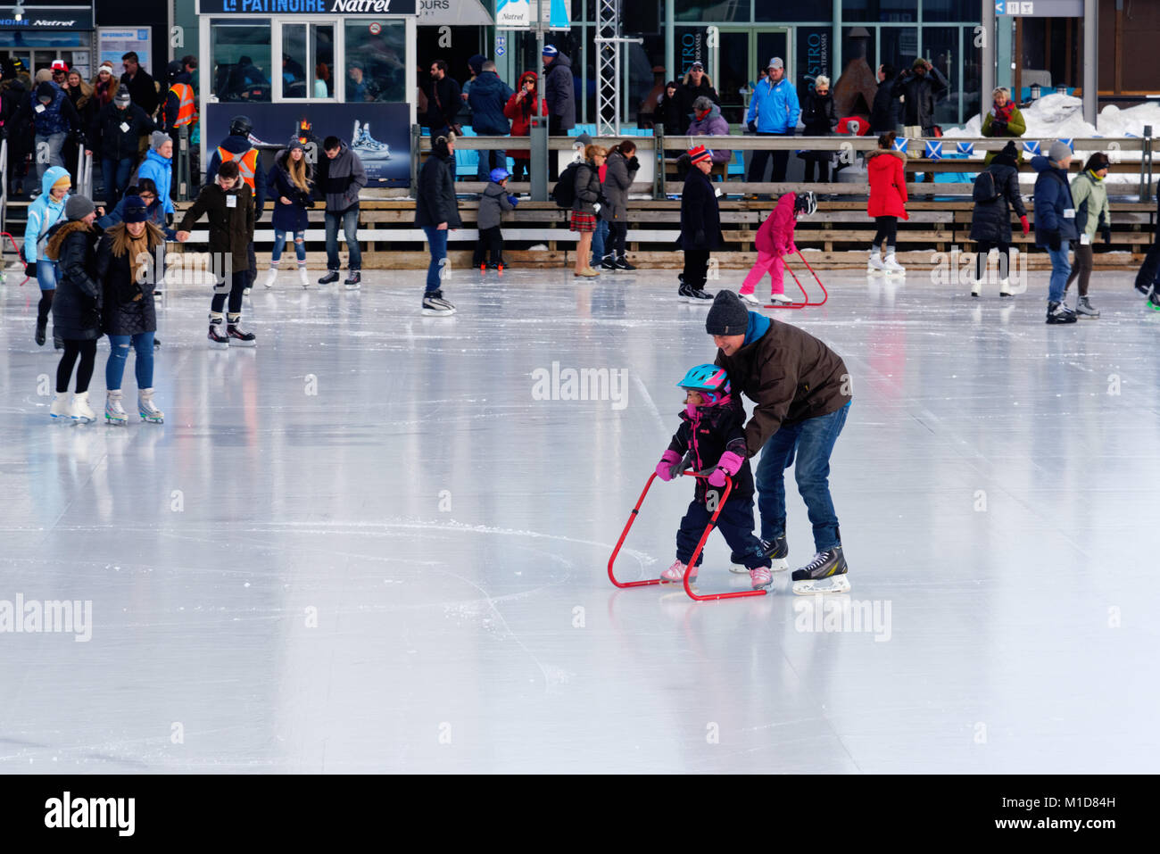 Children learning to skate on ice skating rink in the Old Port (Vieux ...