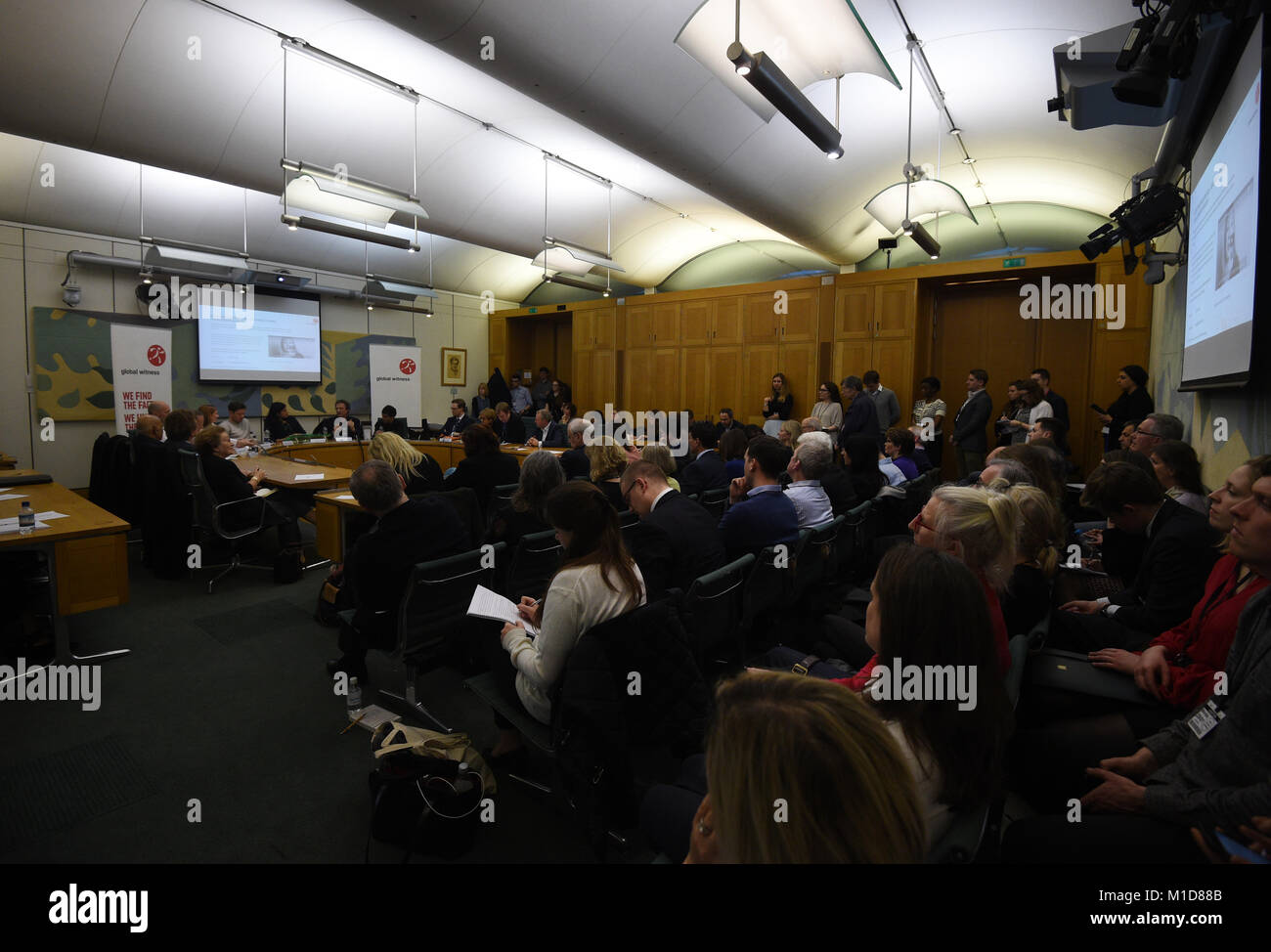 Journalists at an event held by the anti-corruption NGO Global Witness ...
