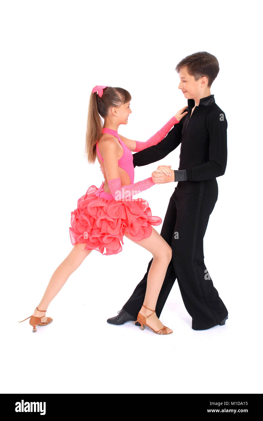 Boy and girl dancing ballroom dance on white background Stock Photo - Alamy
