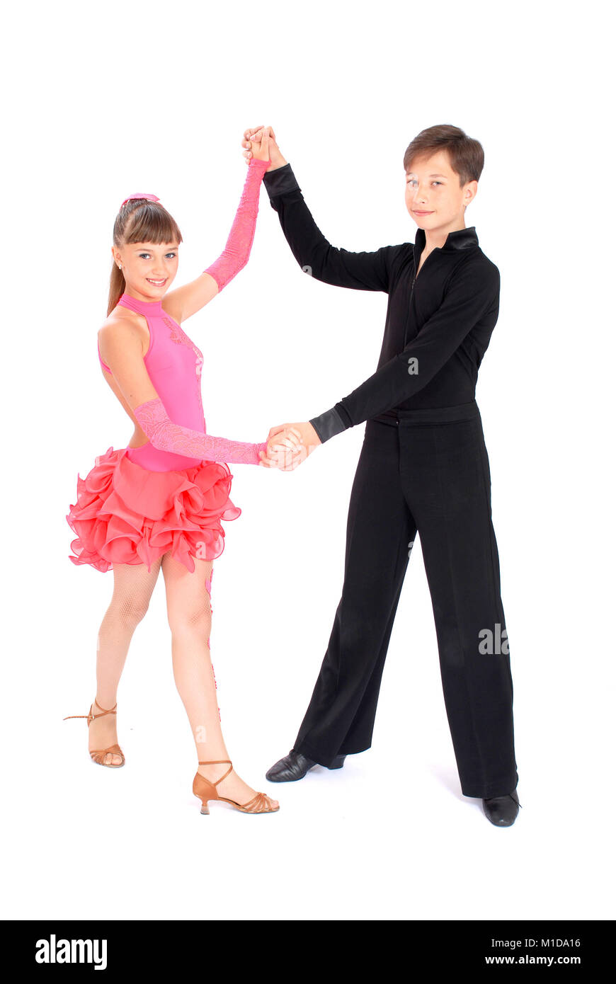 Boy and girl dancing ballroom dance on white background Stock Photo - Alamy