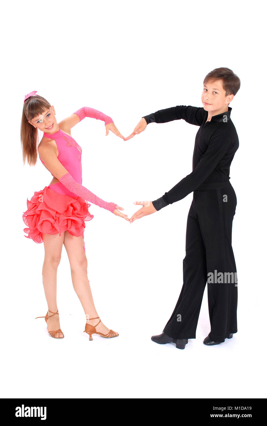 Boy and girl dancing ballroom dance on white background Stock Photo - Alamy
