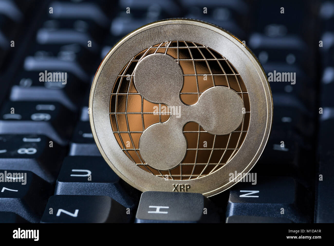 ripple coin on a keyboard Stock Photo - Alamy