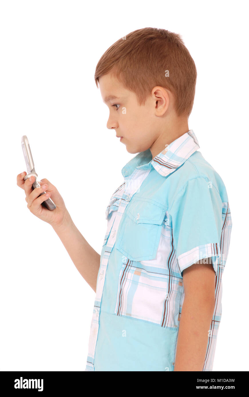 Young boy send text message with mobile phone Stock Photo - Alamy