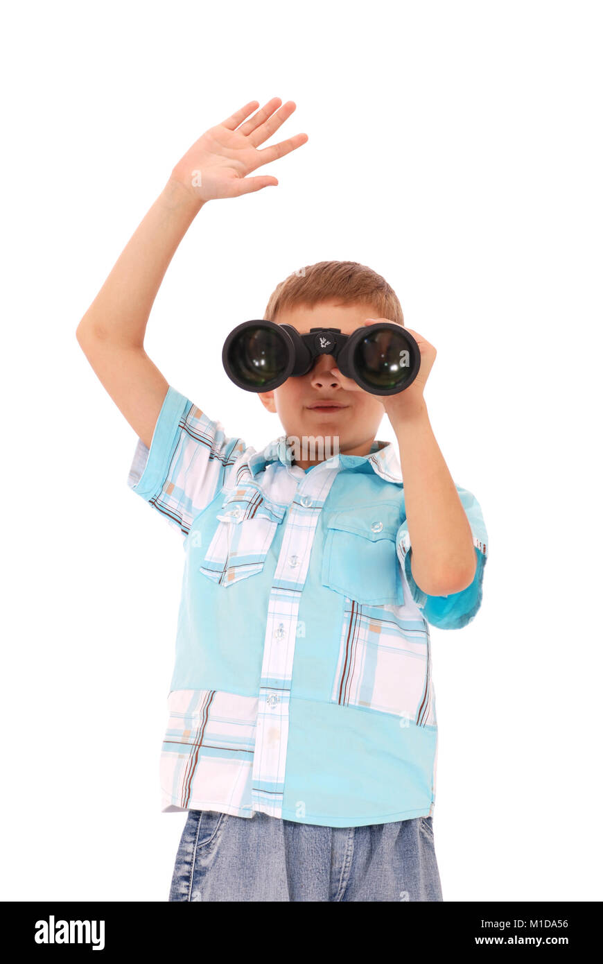 Photo of an adorable boy watching after binoculars isolated in white ...
