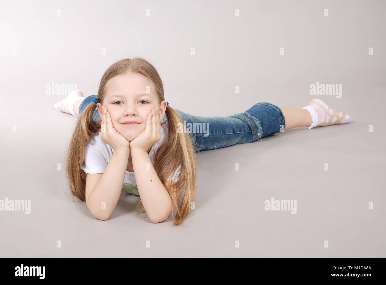 Studio photo girl on grey background Stock Photo - Alamy