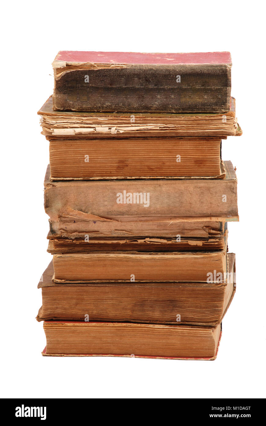 Stacked old books of different shape and color. Isolated on white ...