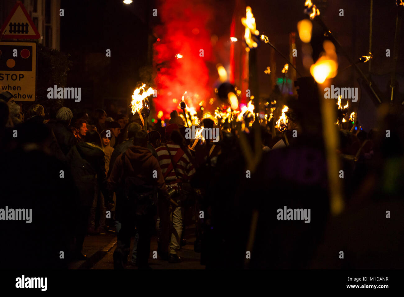 People with lit torches, rye bonfire night parade, east sussex, uk ...