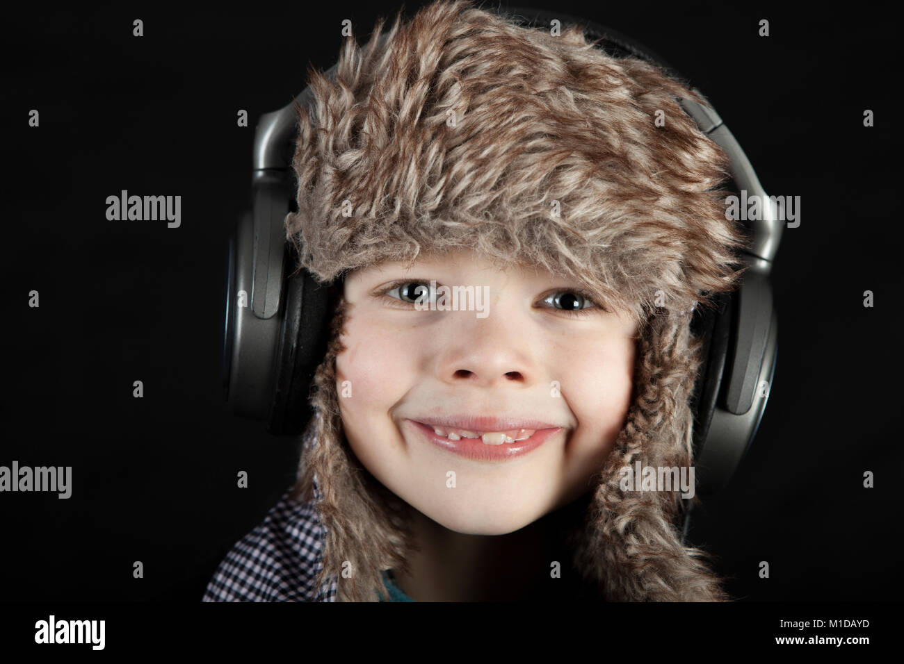 young boy listen to the music Stock Photo - Alamy
