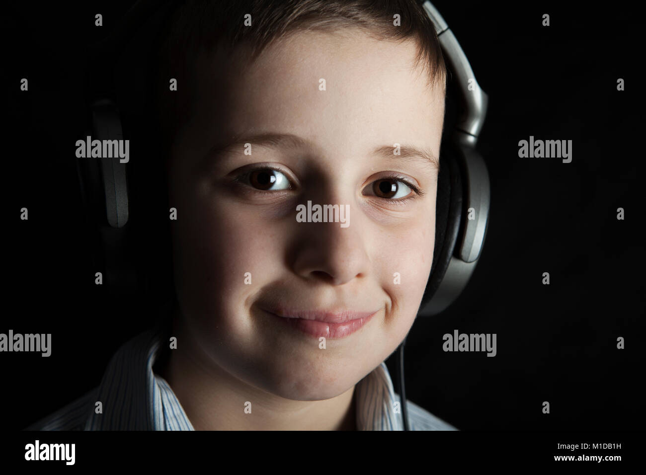 young boy listen to the music Stock Photo - Alamy