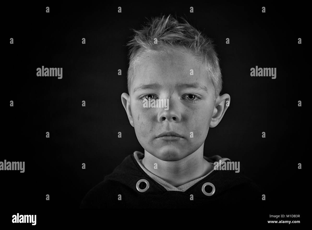 sad young boy Stock Photo - Alamy