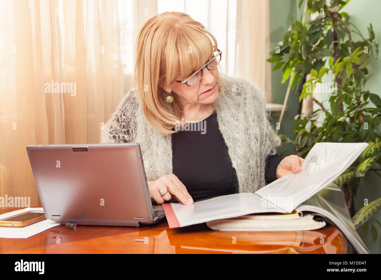 Reviewing documents and reports Stock Photo - Alamy