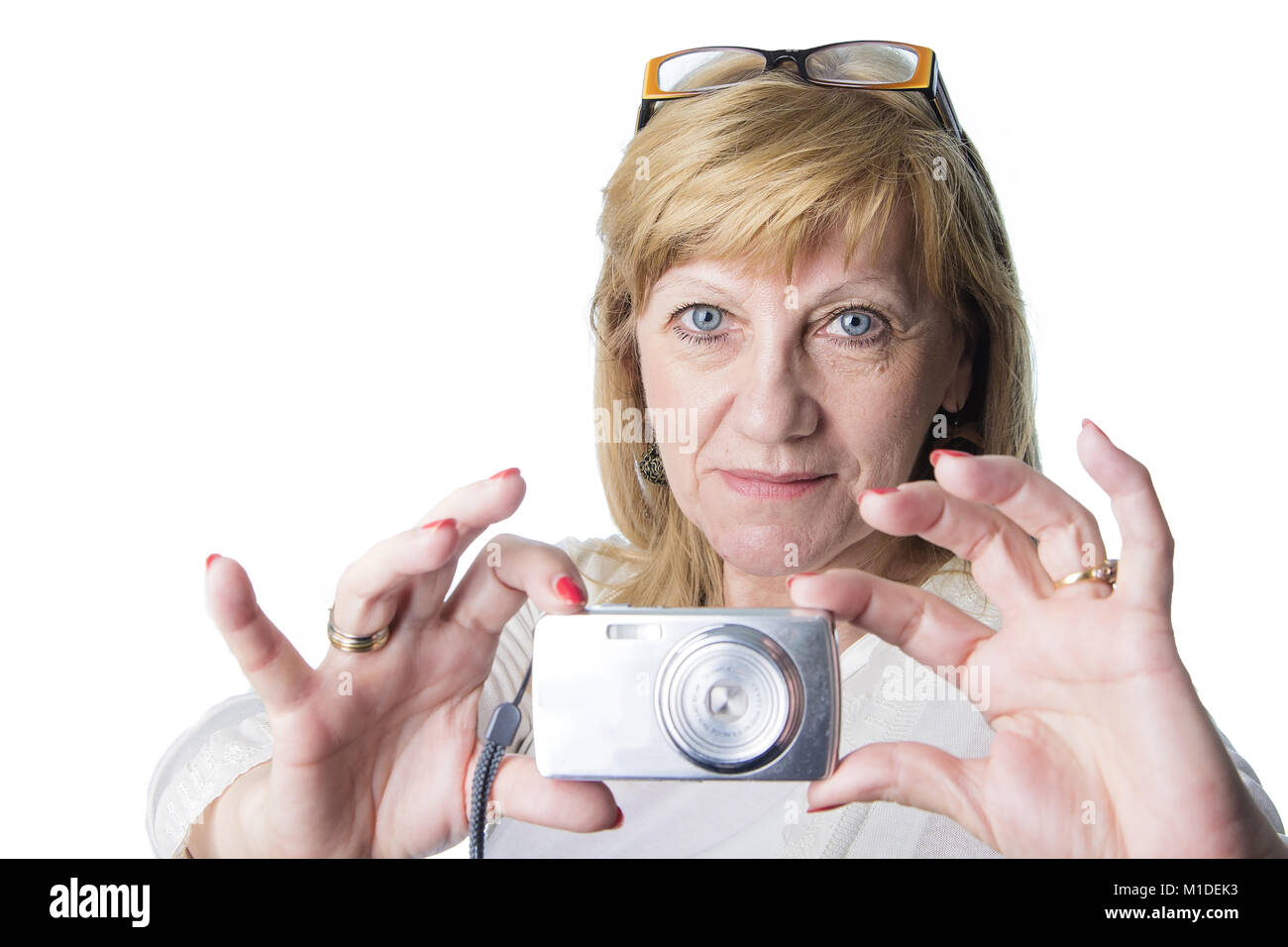 Elderly lady using a compact camera Stock Photo - Alamy