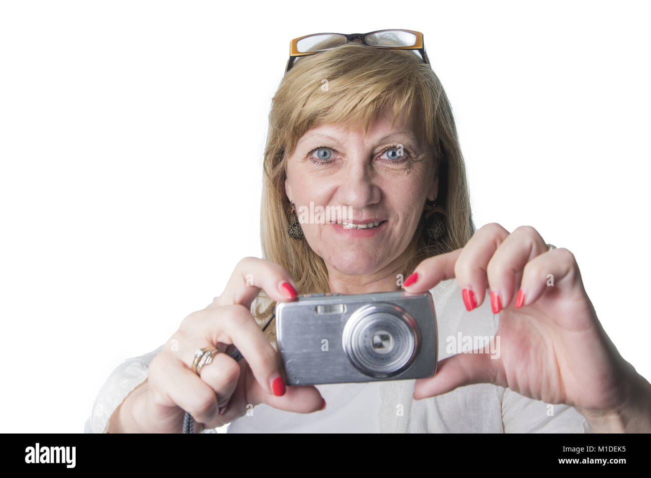 Elderly lady using a compact camera Stock Photo - Alamy