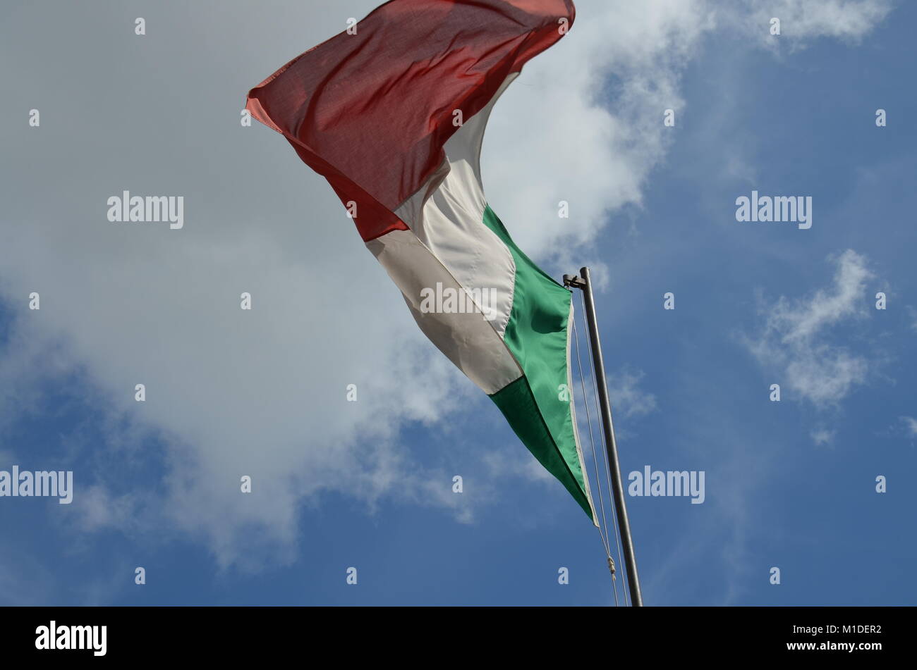 Italy flag flying in the wind Stock Photo - Alamy
