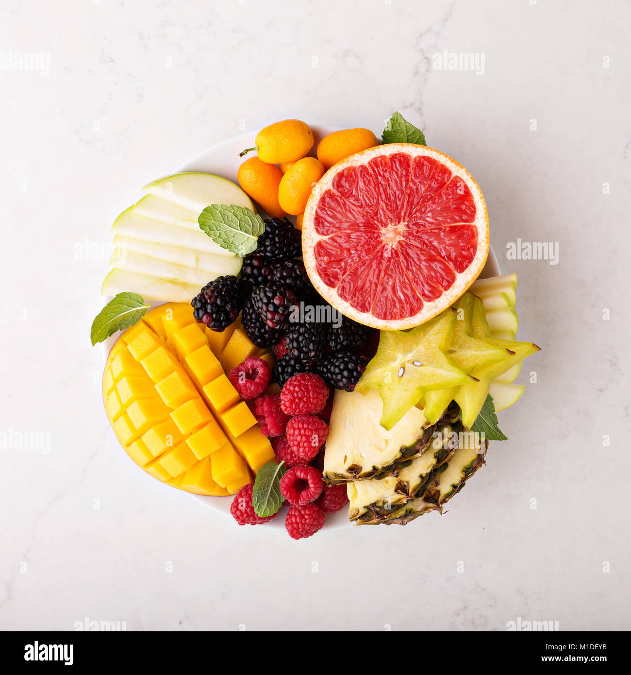 Fruit plate with mango, grapefruit and berries Stock Photo - Alamy