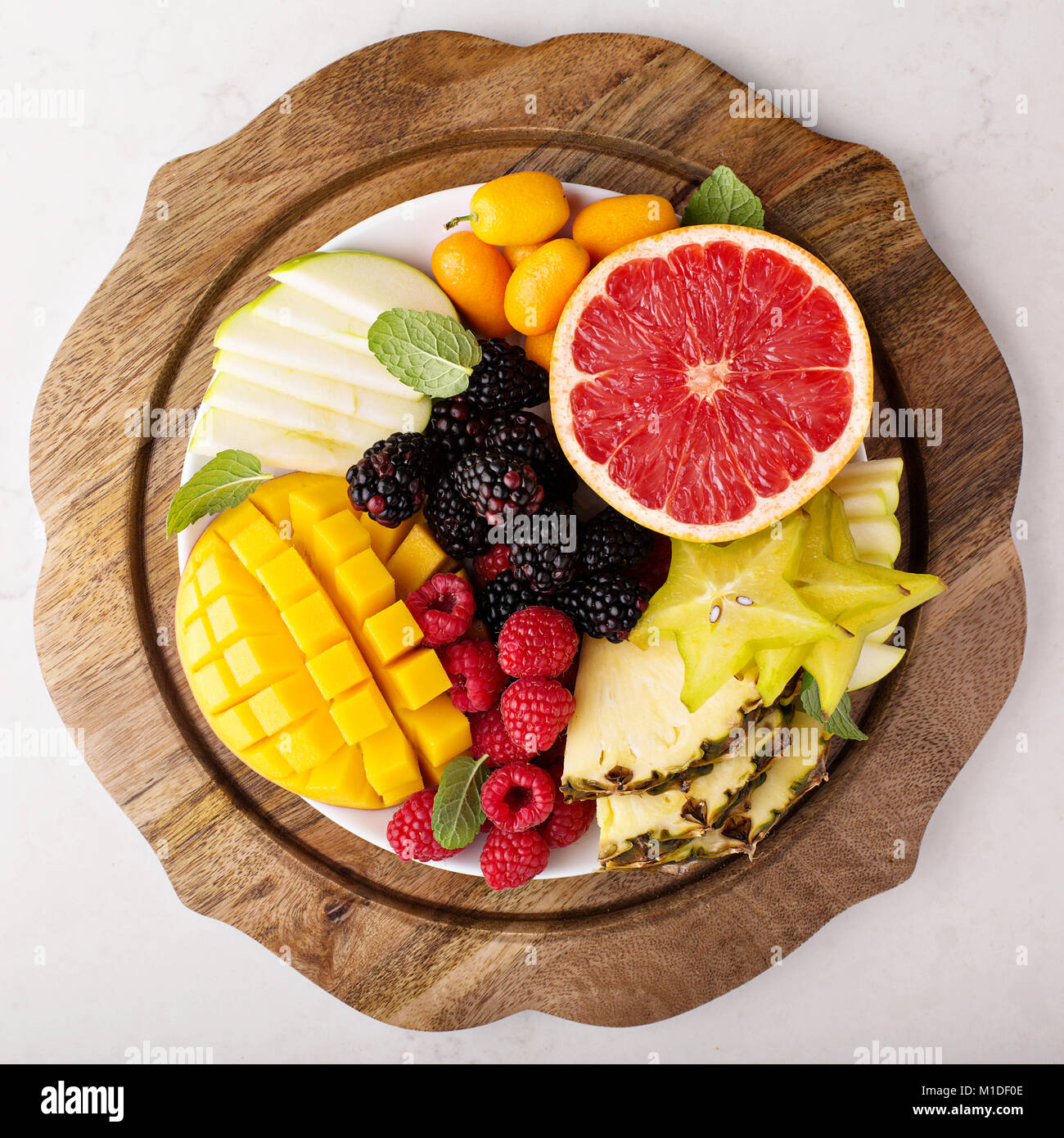 Fruit plate with mango, grapefruit and berries Stock Photo - Alamy