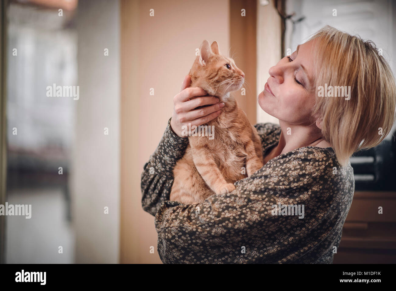 A woman and her cat Stock Photo - Alamy