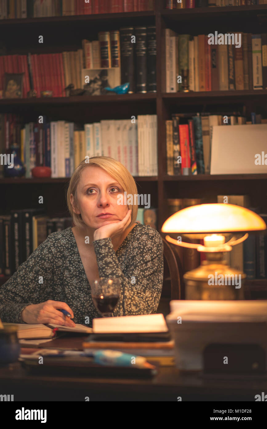 She's writing a book Stock Photo - Alamy