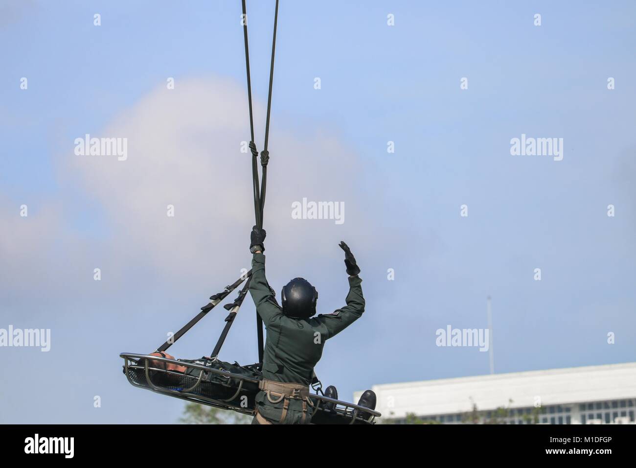 Soldier rescue emergency by army helicopter with rope on blue sky Stock ...