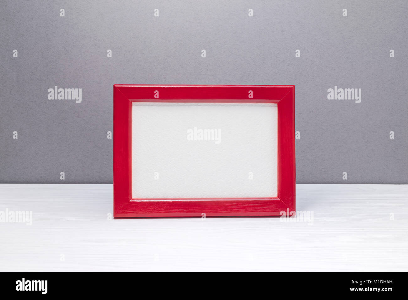 empty wooden red photo frame on grey wall background. minimalism design ...