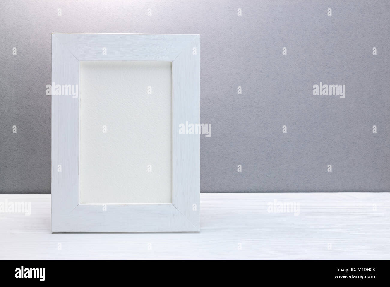 empty wooden white photo frame against grey background Stock Photo - Alamy