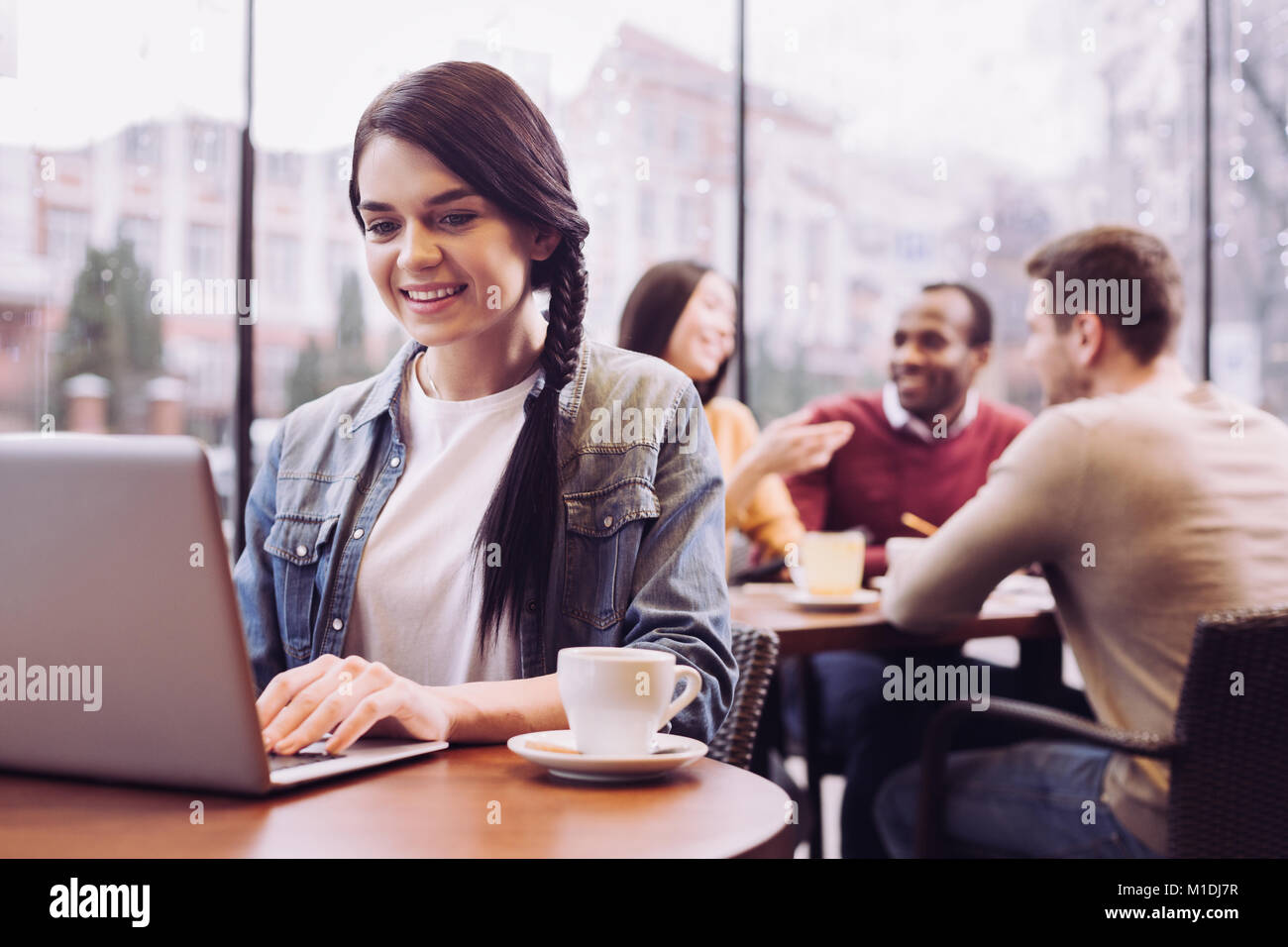Appealing merry woman typing message Stock Photo - Alamy