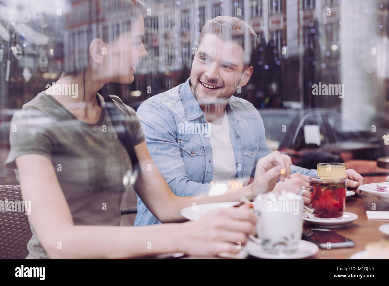 Joyful two friends flirting Stock Photo - Alamy