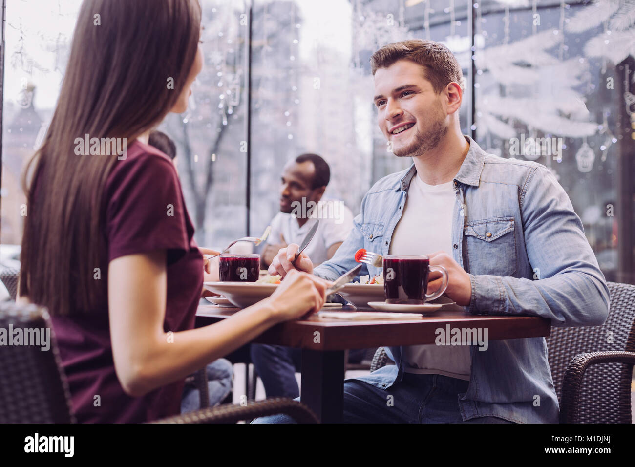 Irresistible happy couple visiting cafe Stock Photo - Alamy