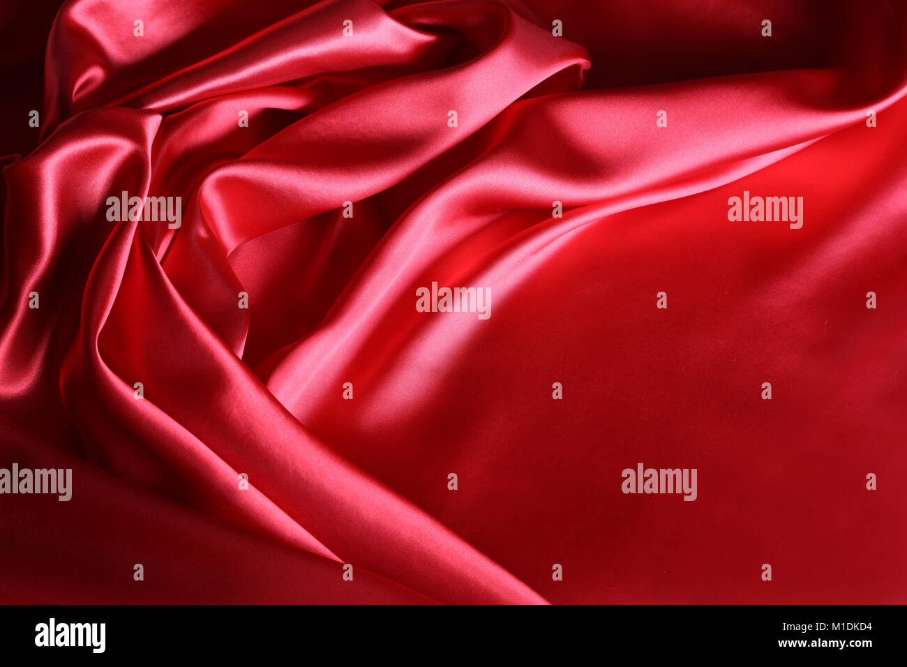 Closeup of ripples in red silk fabric Stock Photo - Alamy