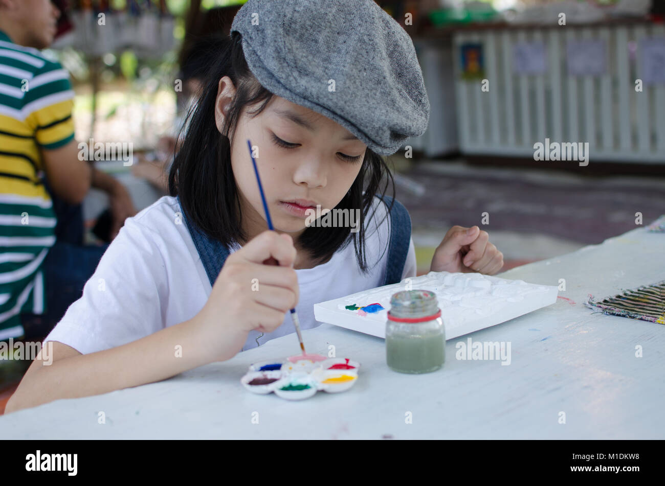 Kids asian Coloring Tray Coloring on the Table Stock Photo - Alamy
