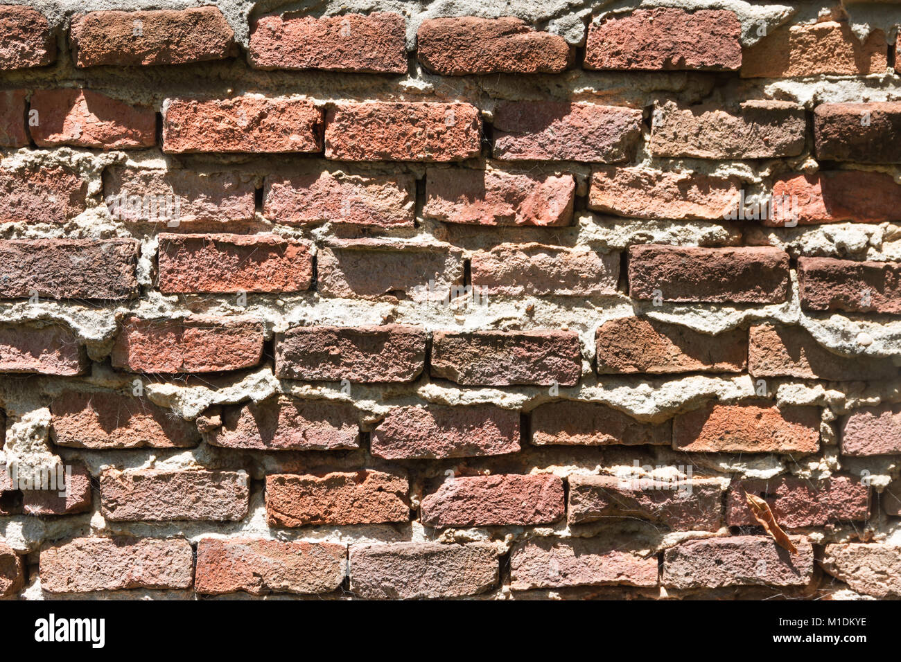 background of uneven old bricks with shadows Stock Photo - Alamy