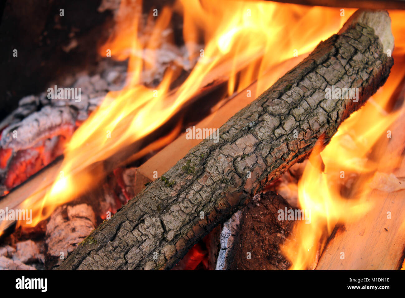 Flaming Logs On Fire Stock Photo - Alamy
