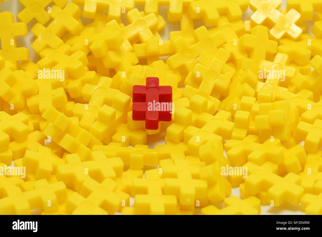 Group of yellow puzzle and one different Stock Photo - Alamy