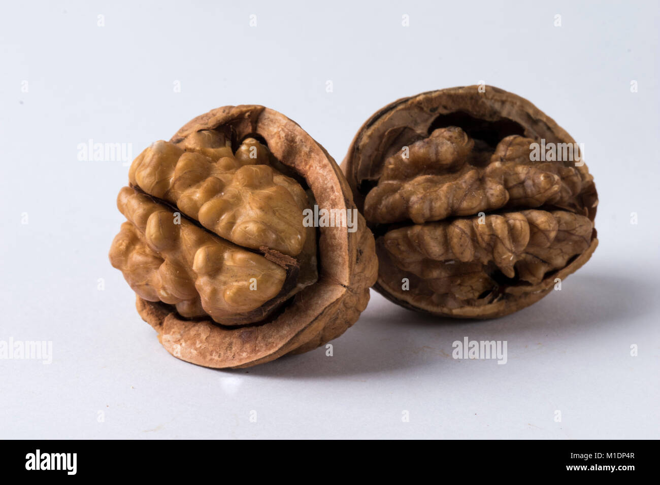 Walnuts in shell isolated on a white background Stock Photo - Alamy
