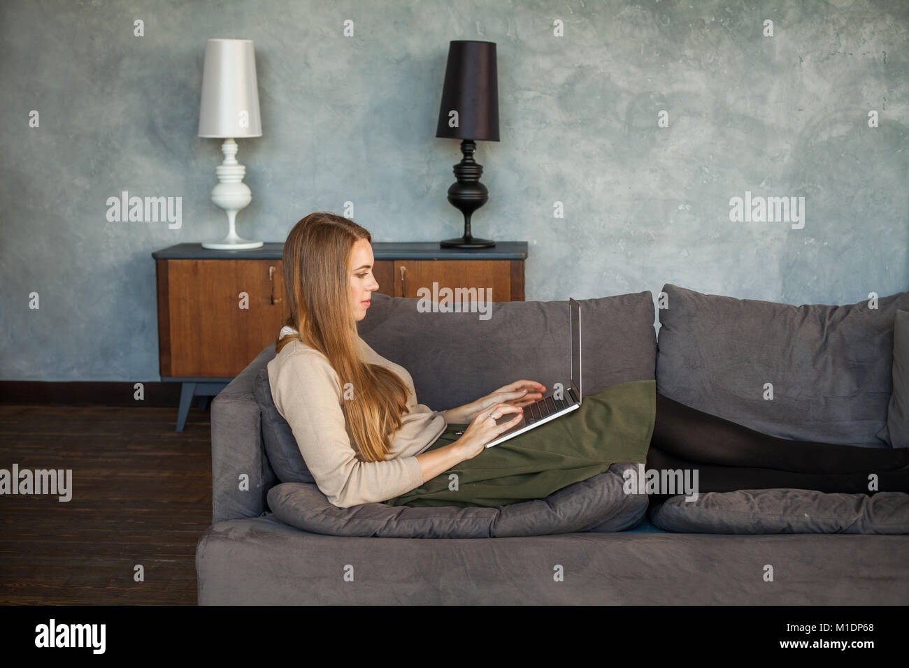 Laptop girl home hi-res stock photography and images - Alamy