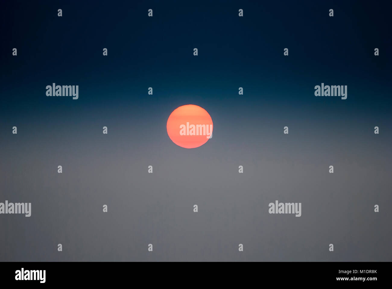 Rising sun in the dark sky Stock Photo - Alamy