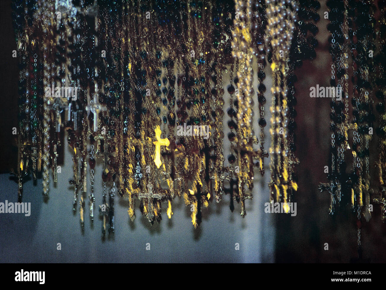 Golden chains and crosses on display at a church in Prague Stock Photo ...