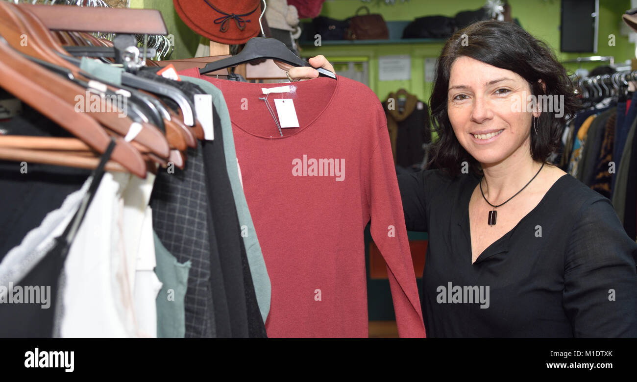 Woman buying clothes in a bazaar Stock Photo - Alamy