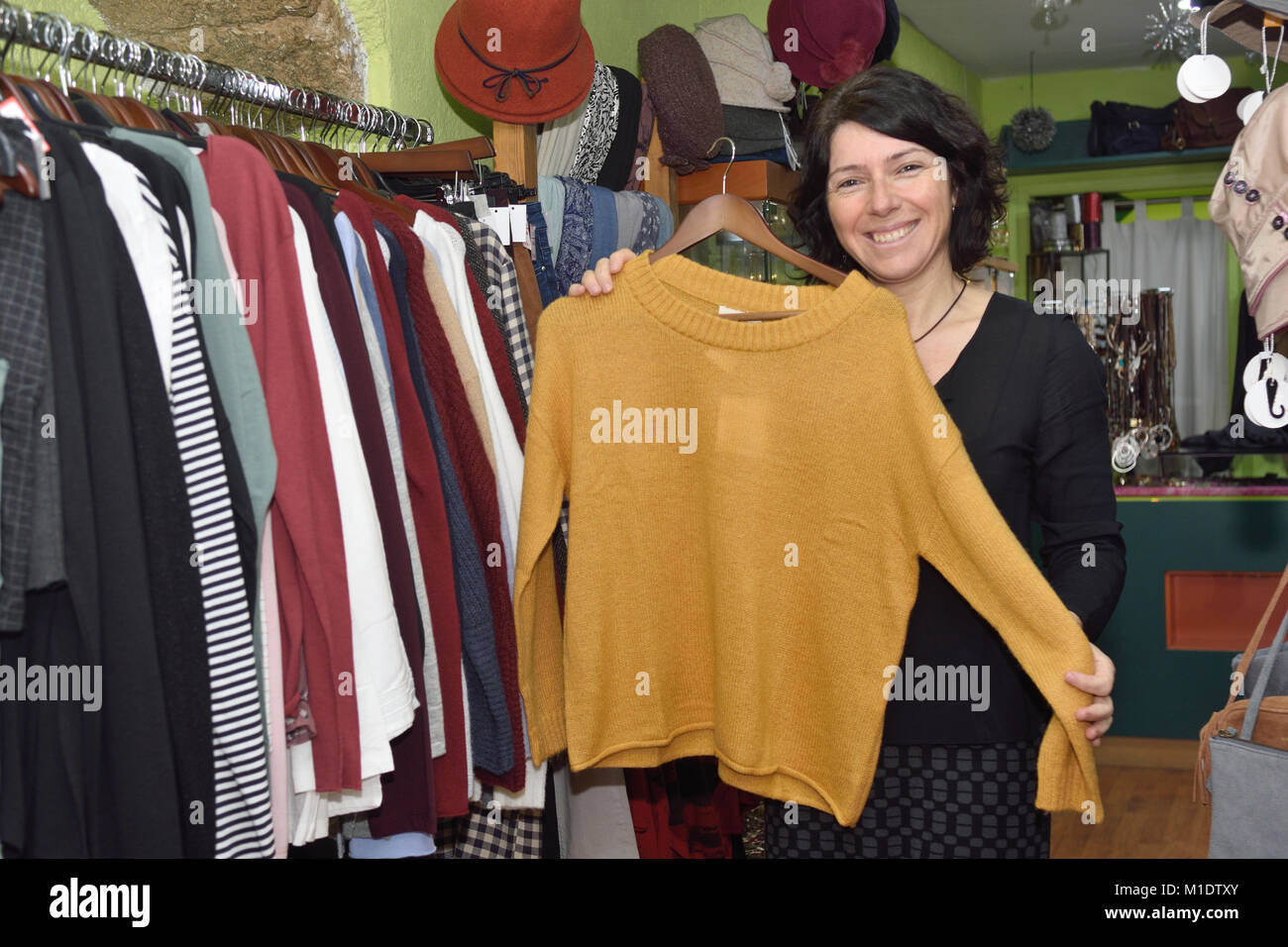 Woman buying clothes in a bazaar Stock Photo - Alamy