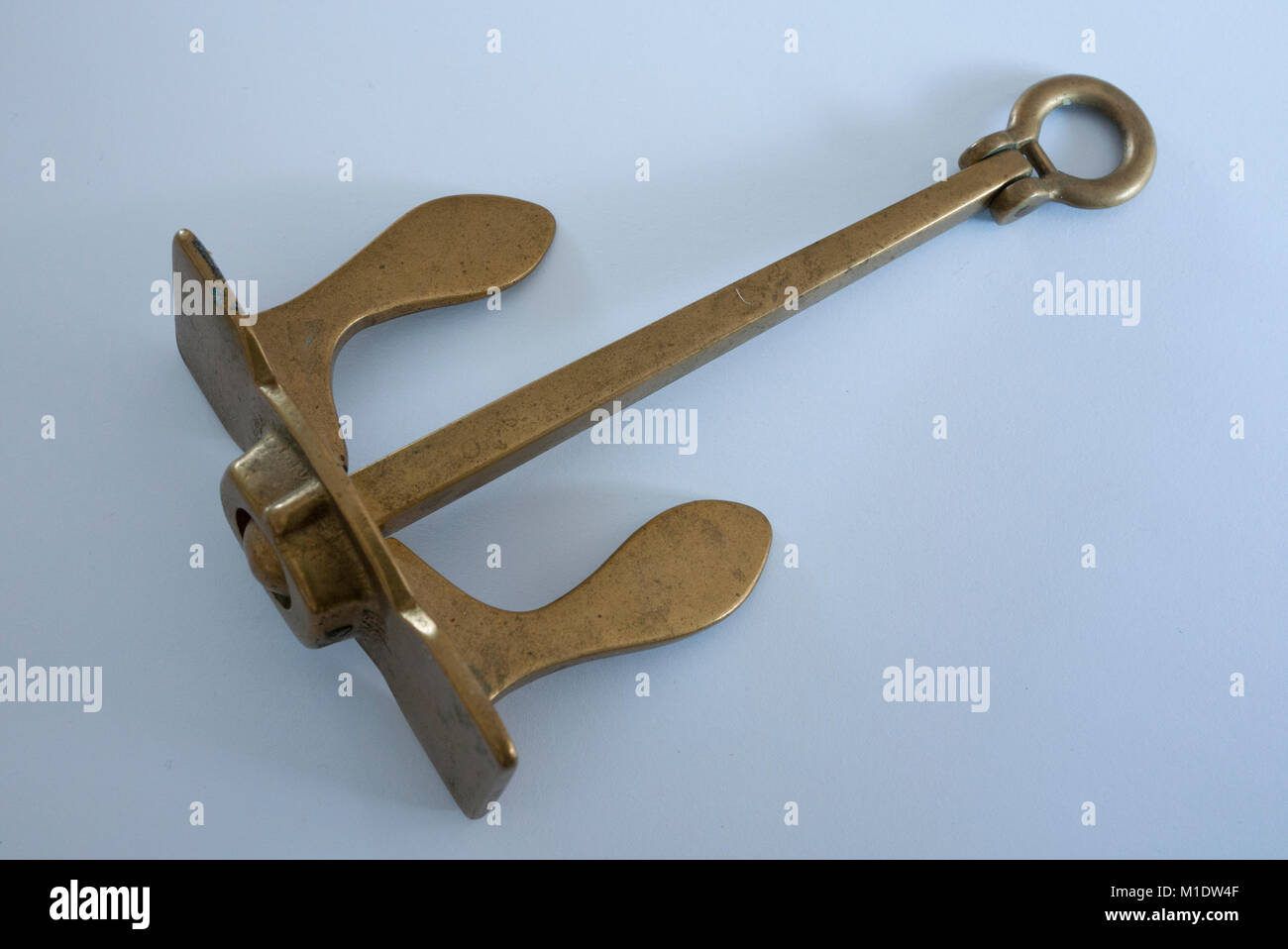 miniature brass anchor Stock Photo - Alamy
