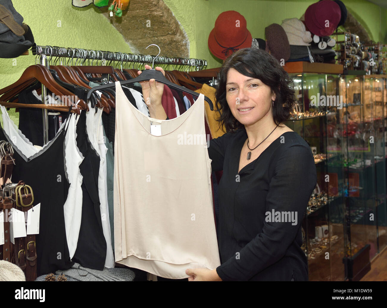 Woman buying clothes in a bazaar Stock Photo - Alamy