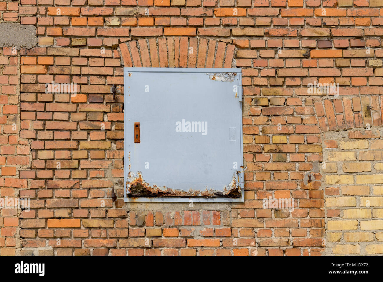 Old rusty window hatch in a brick wall Stock Photo - Alamy