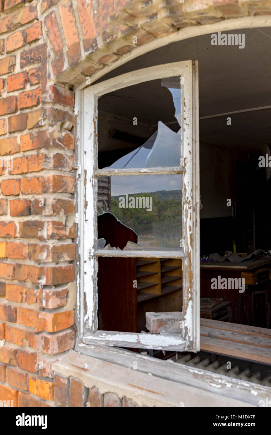 Window with broken glass panes in brick wall Stock Photo - Alamy