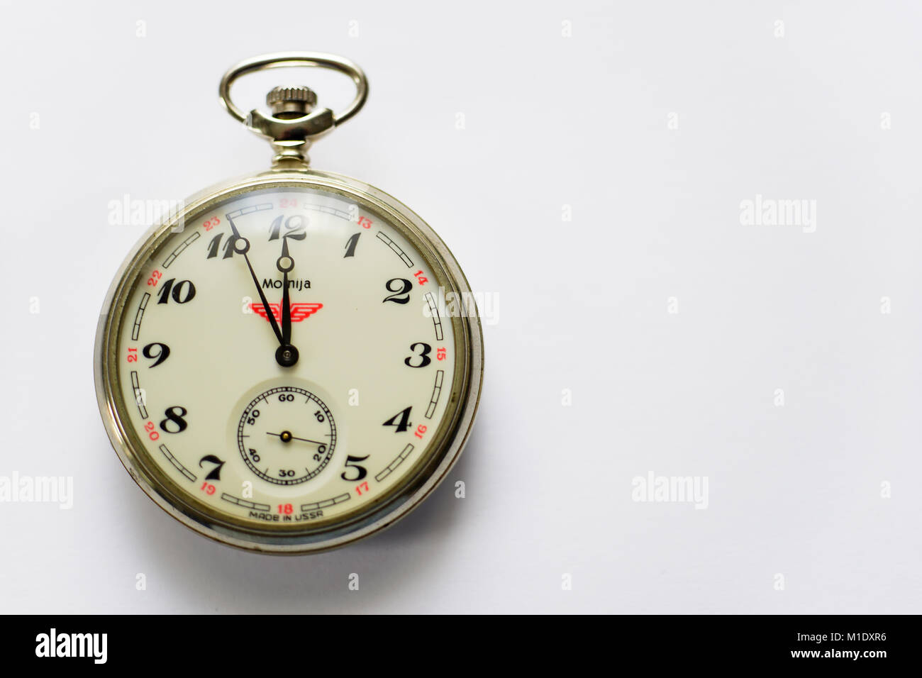 Pocket watch with black hands and second hands Stock Photo - Alamy