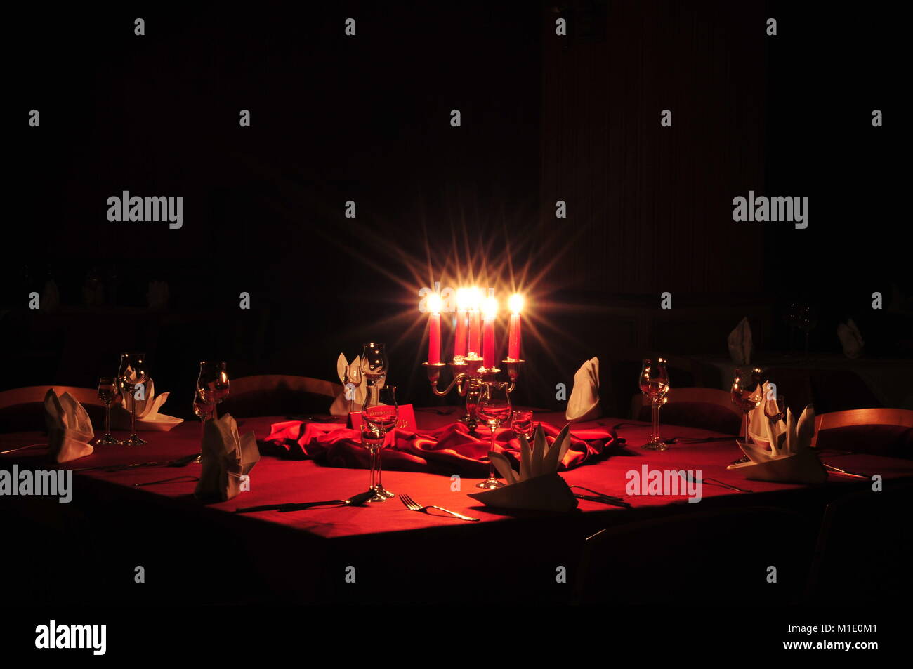 Ornate table setting with candles at night Stock Photo - Alamy