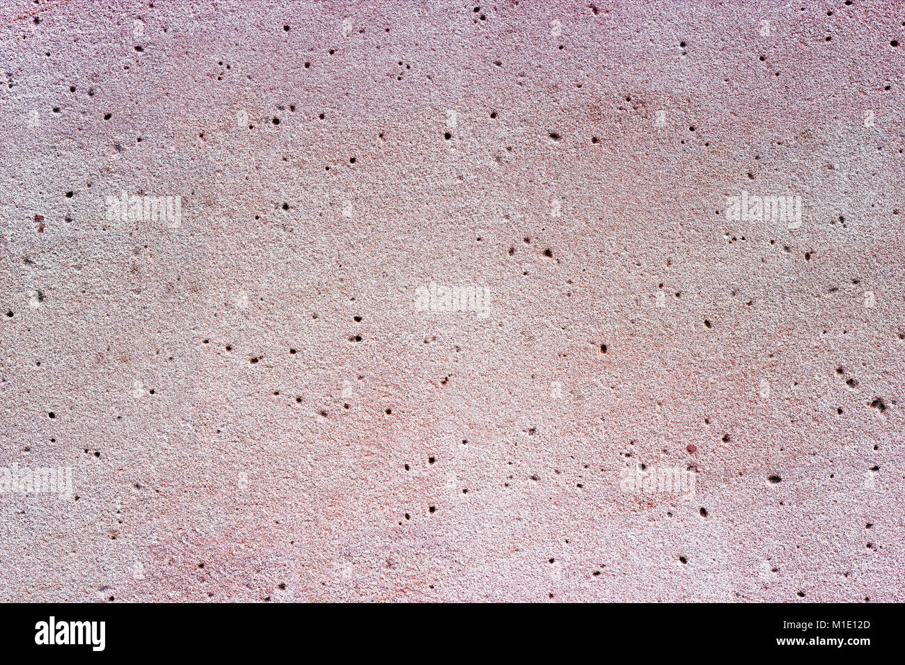 Light-colored sandstone with small holes as wallpaper Stock Photo - Alamy
