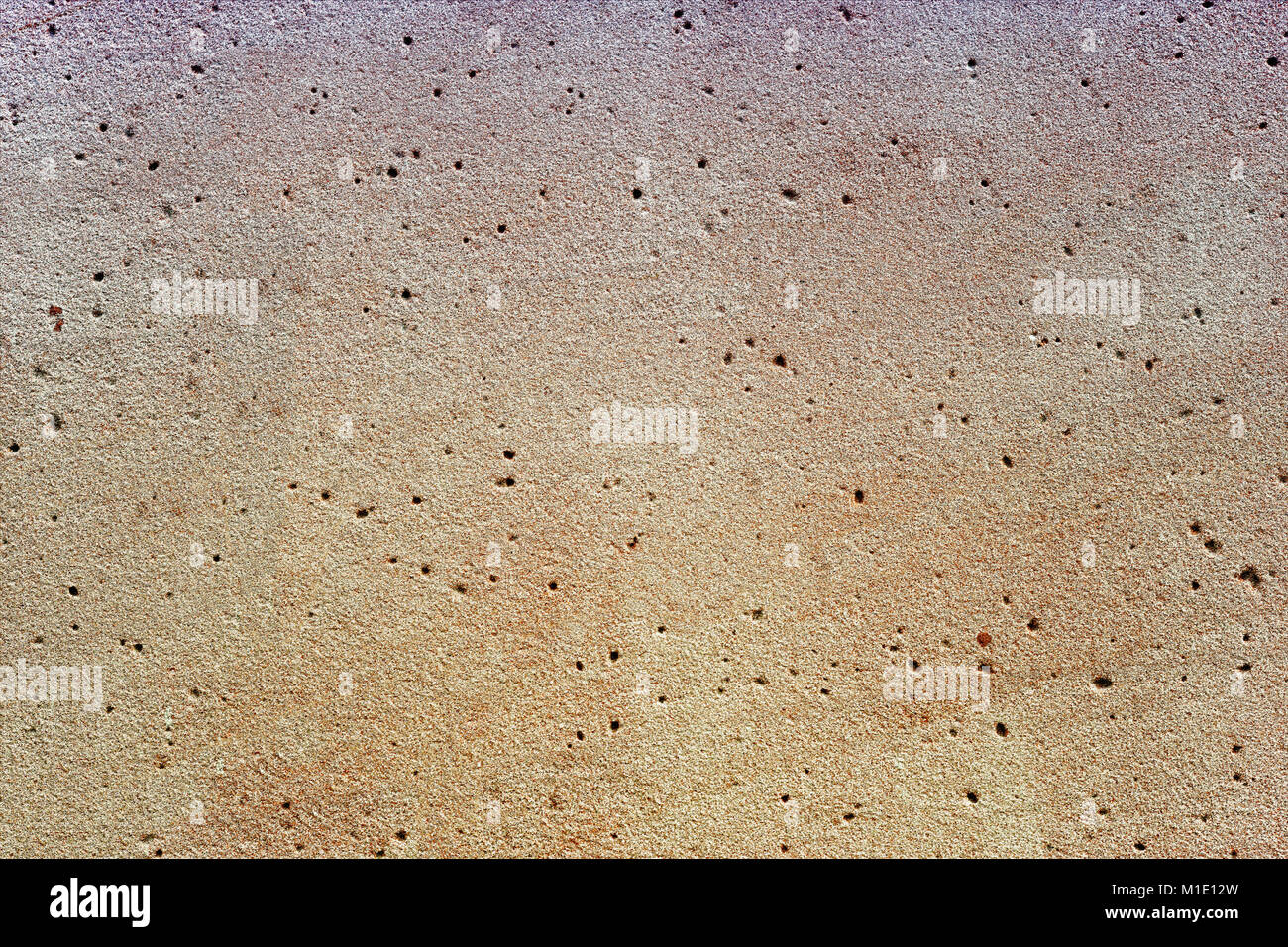Light-colored sandstone with small holes as wallpaper Stock Photo - Alamy