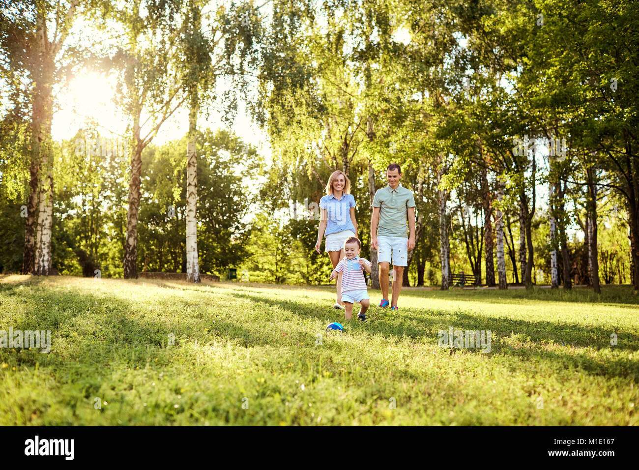 Happy family in nature Stock Photo - Alamy