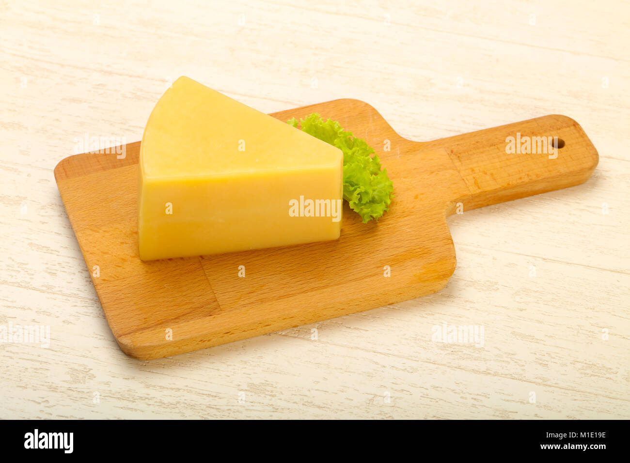 Parmesan cheese triangle Stock Photo - Alamy