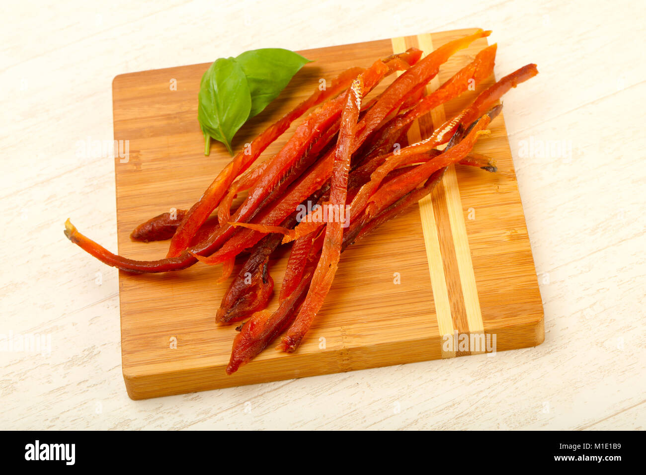 Salmon dry sticks snack Stock Photo - Alamy